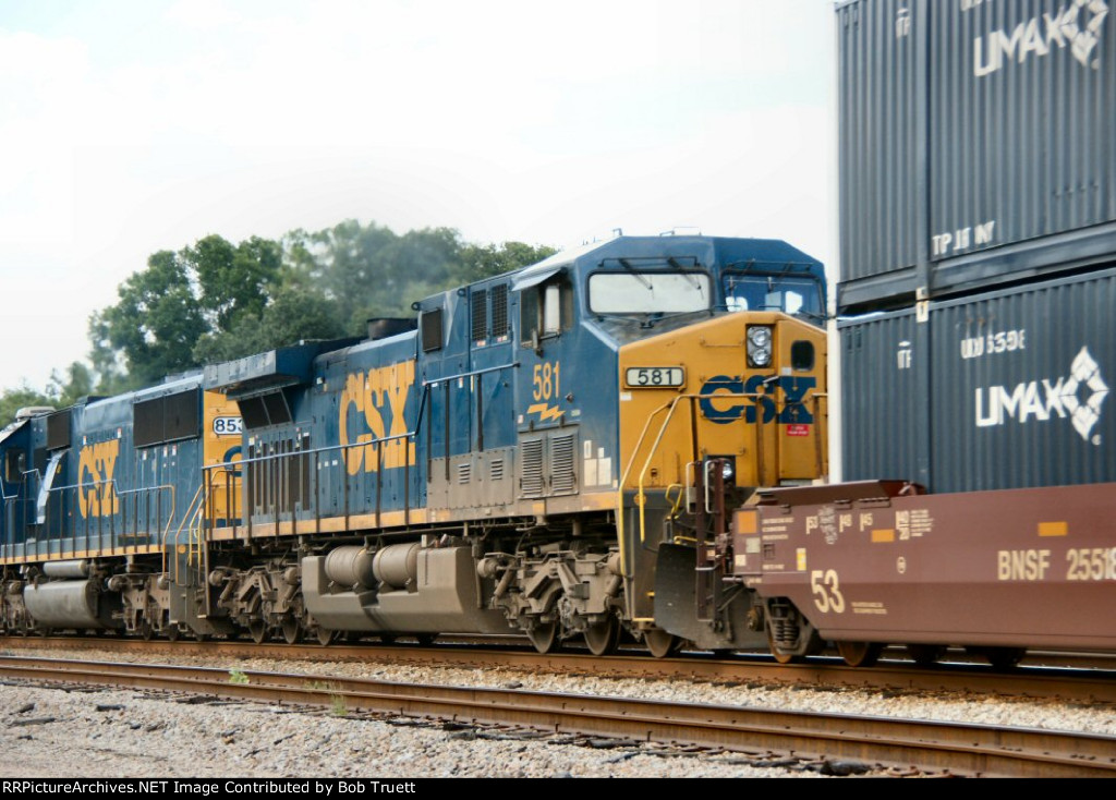 CSX 5441, 8538, and 581 heading North with a train of loaded well cars